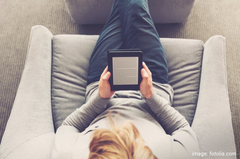 Ongoing – woman e-reader inside chair – Ebook Friendly