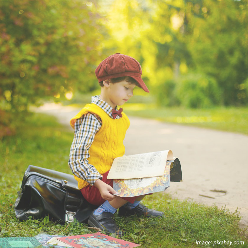 Ongoing – boy reading book after school – Ebook Friendly